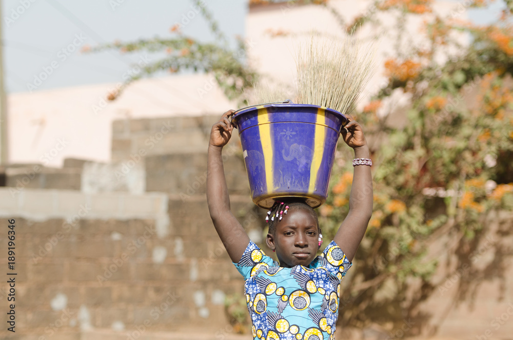 Child Labour Concept - Little African Girl Working for her Family Stock ...