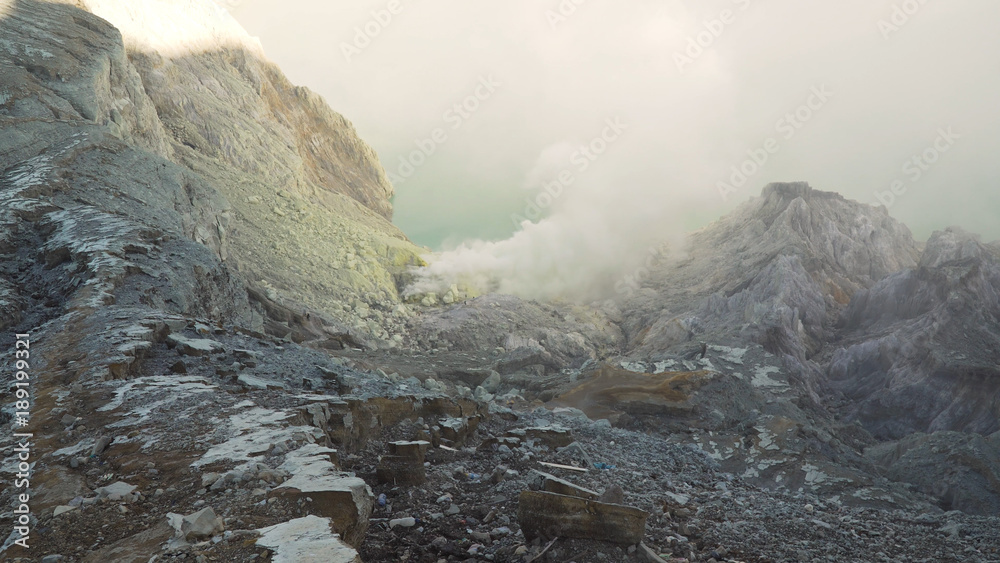 Extraction of sulfur in the crater of a volcano. Sulfur, sulfur gas ...