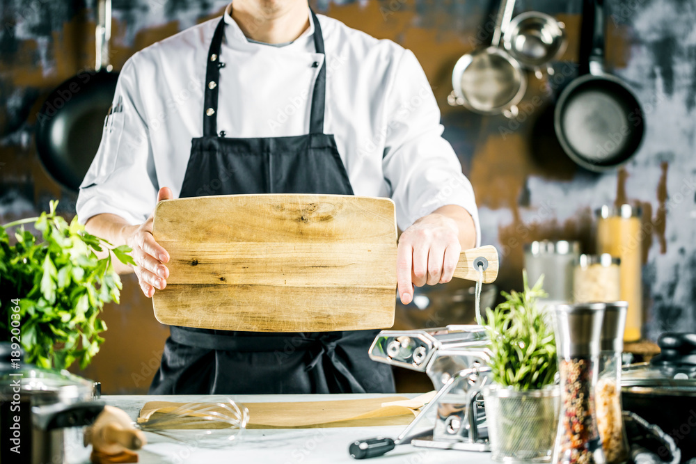 Chef Koch in der Küche Stock-Foto | Adobe Stock