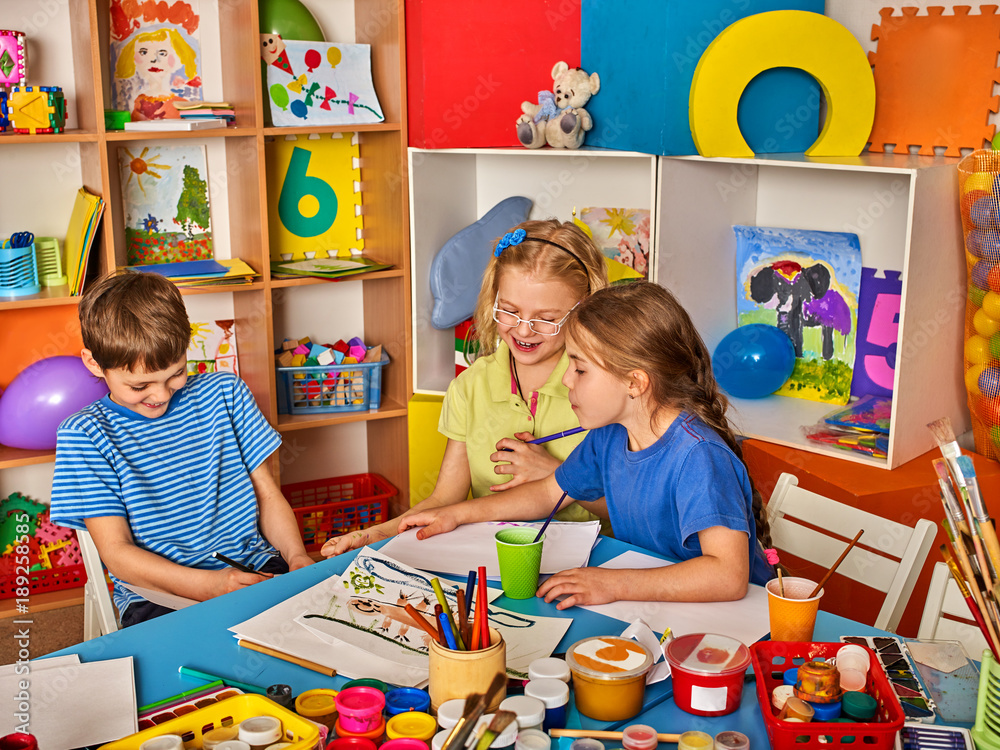 Foto de Small students painting in art school class. Children boy and ...
