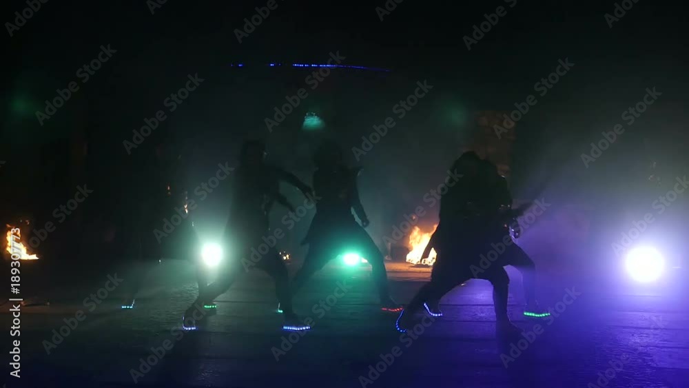Street dancing. Slow motion. Five dancers dance in the night with shoes ...