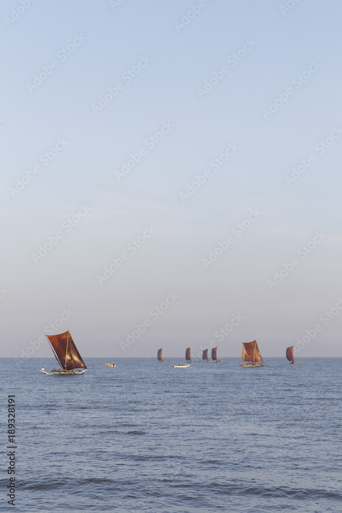 Traditional wooden catamarans used for fishing sail the Indian Ocean ...