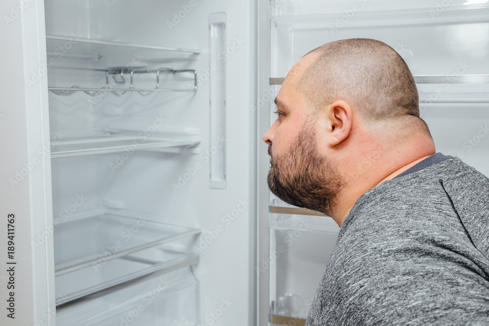 Looking In Empty Refrigerator