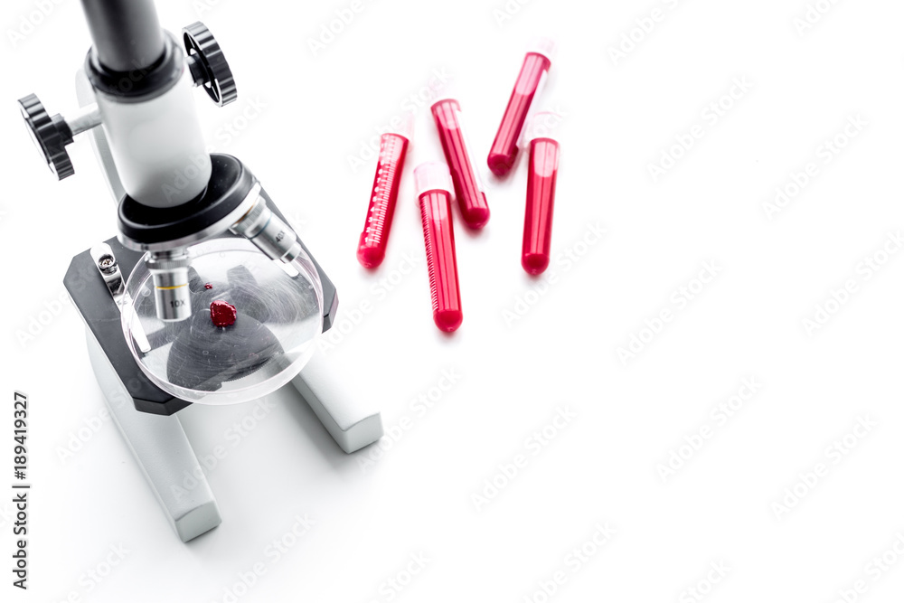 Blood analysis in clinacal lab. Test tubes near microscope on white ...