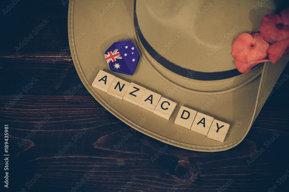 Anzac army slouch hat with Australian Flag on vintage wood background ...