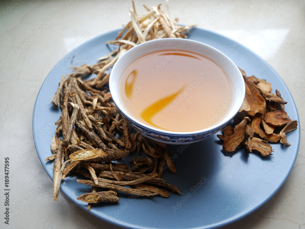 Bowl of chinese herb tea with dried assorted roots aside. Stock Photo ...