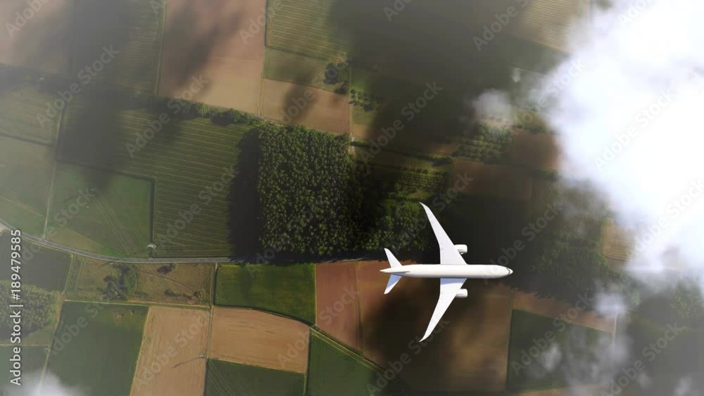 Top view of white brandless passenger airplane flying above fluffy ...