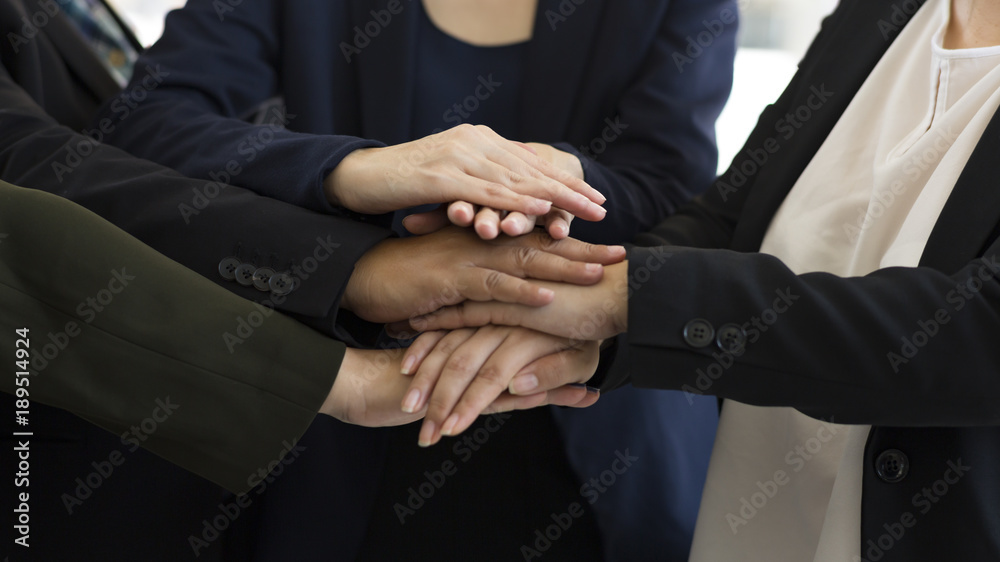 Group of business people stacked hand together , symbol of strong team ...