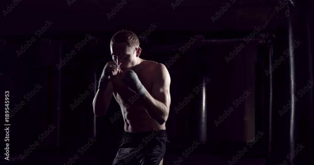 Kickboxer shadow boxing as exercise for the fight. Fighter training ...