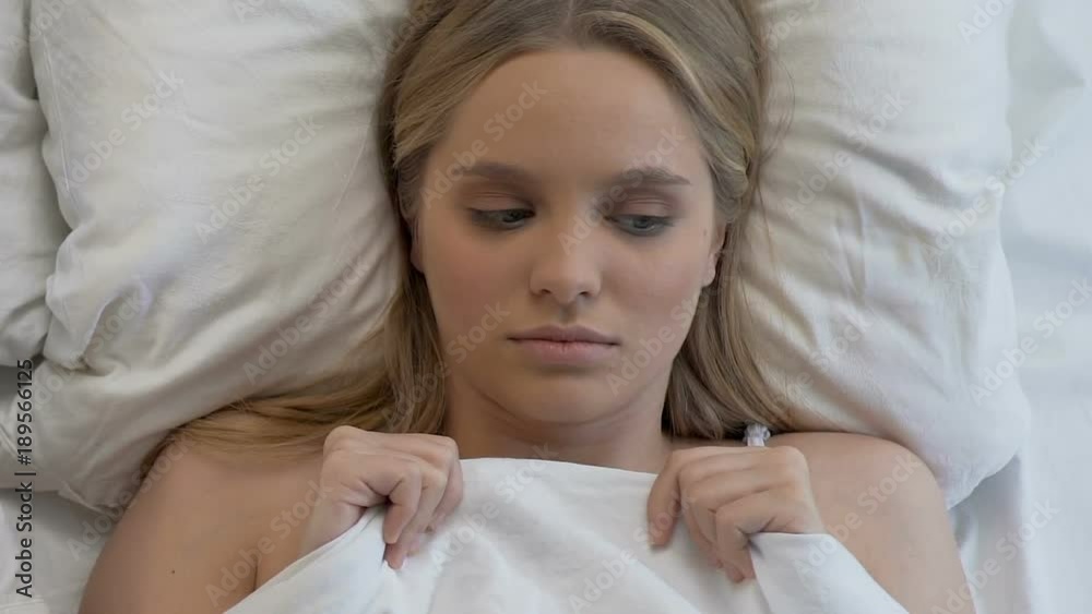 Beautiful Young Woman In Bed Feeling Shy Before First Sex Experience Confusion Stock Video