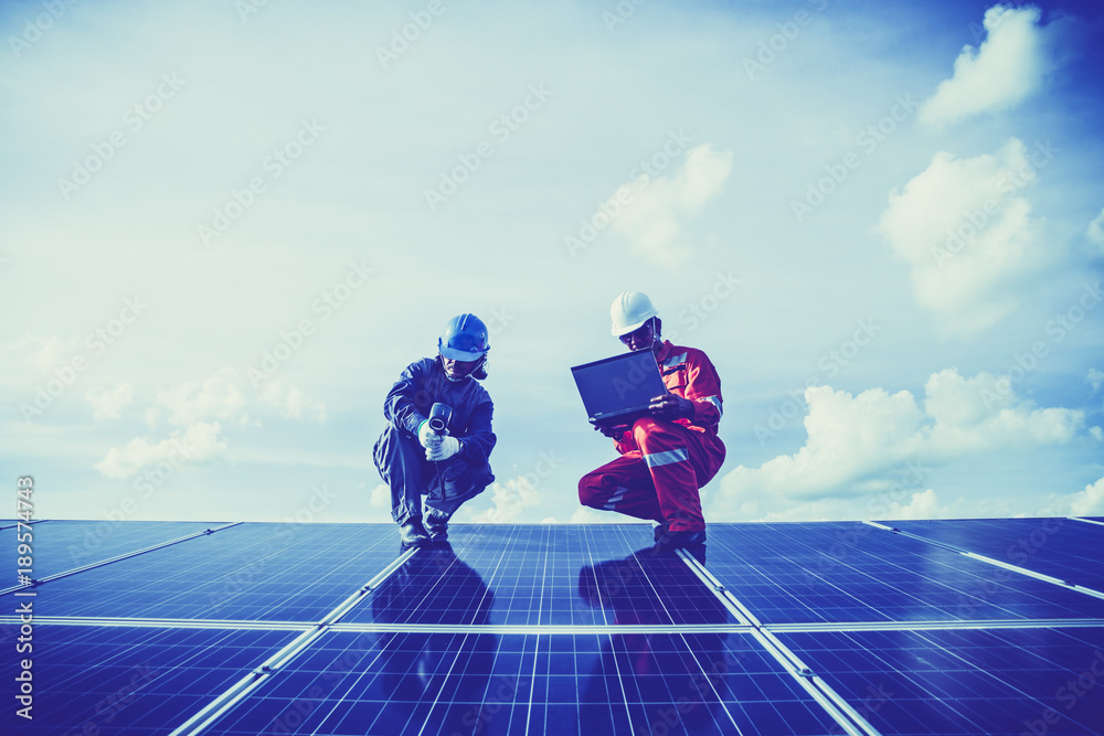 engineer checking heat of solar panel and using ir camera to scan ...