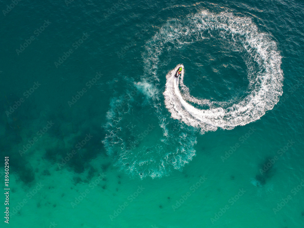 People are playing a jet ski in the sea.Aerial view. Top view.amazing ...