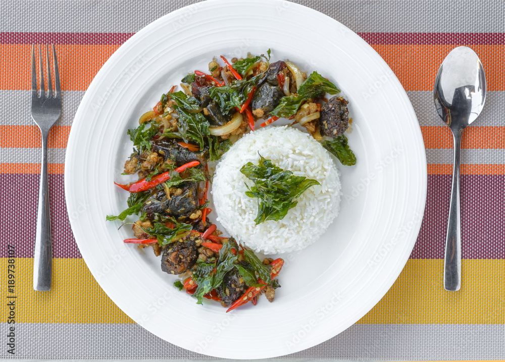 Preserved egg stir-fried with pork mice and basil and rice Stock Photo ...