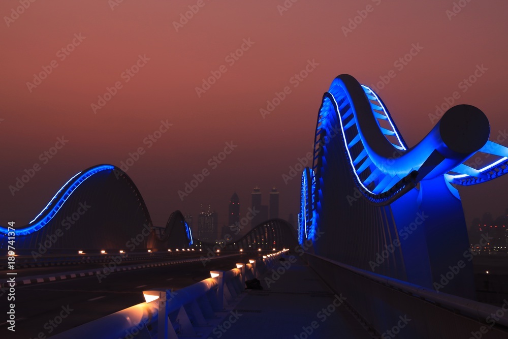 meydan bridge with dubai downtown city skyline as background Stock ...