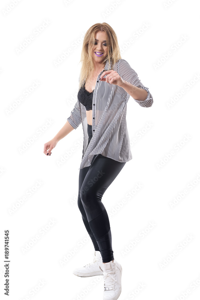 Cheerful smiling excited young funky woman dancing and having fun. Full ...