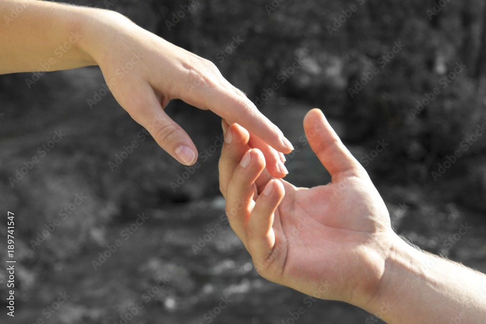 Men's hand gently takes the woman's hand, the concept of love, romance ...