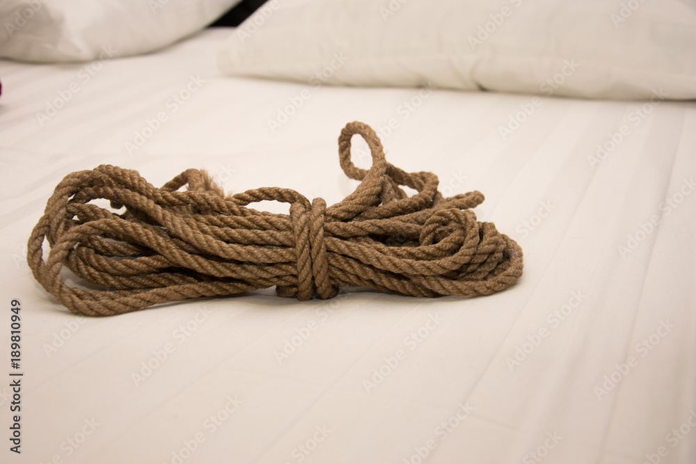 rope for shibari of natural color on a white bed Stock Photo | Adobe Stock