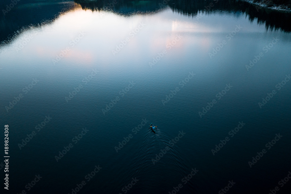 Aerial view of Father and son in kayak on lake Eibsee in Germany during ...