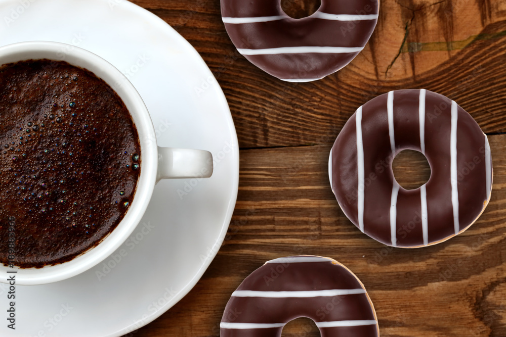 Extremely tasty sweet donut together with aromatic coffee full of ...