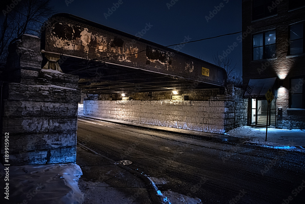Foto de Dark and cold train bridge tunnel underpass and building ...