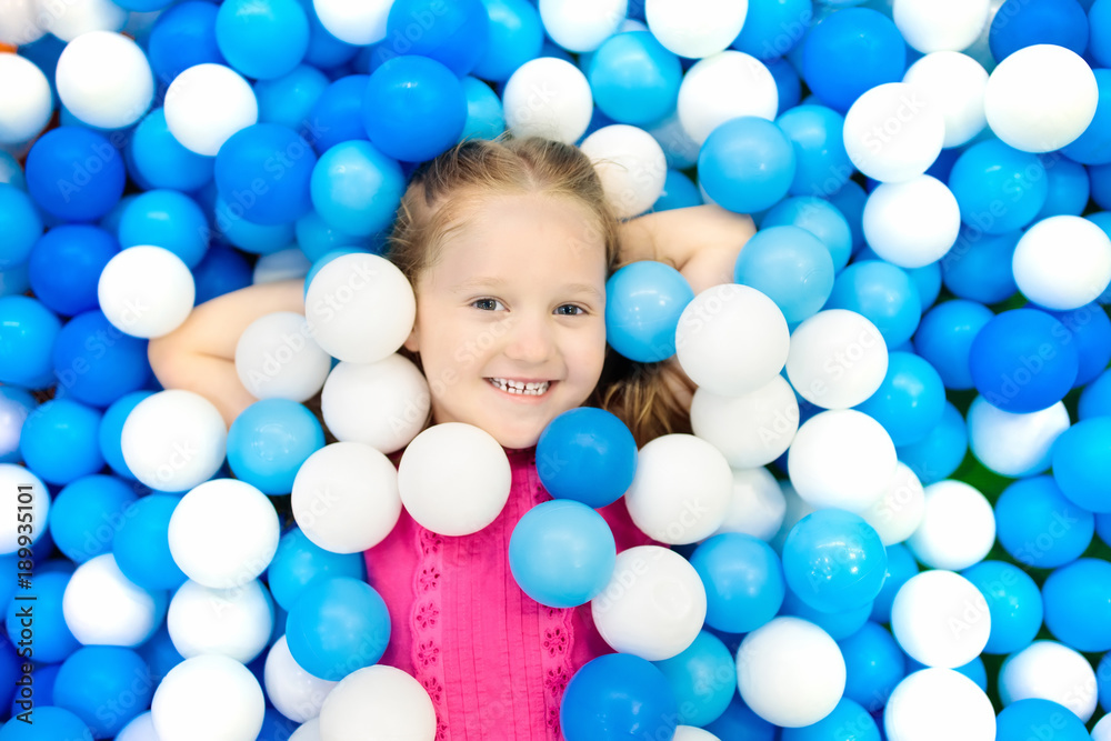 Kids play in ball pit. Child playing in balls pool Stock Photo | Adobe ...