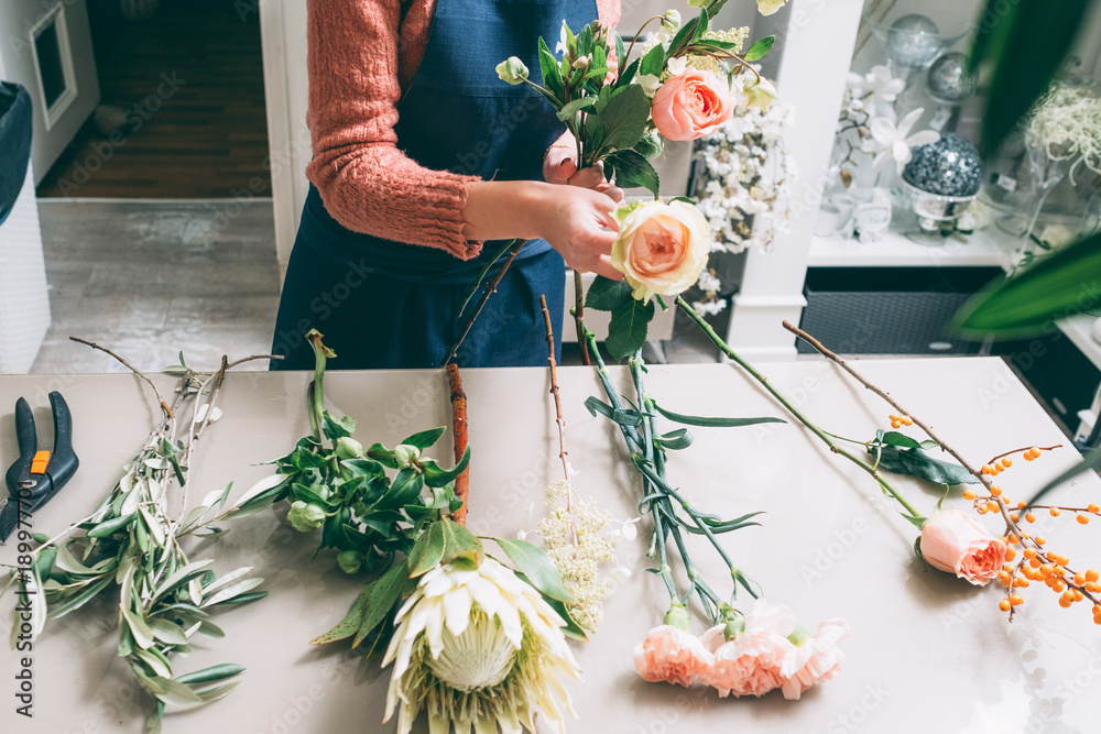 Florist's creative work requires senses of style beauty and proportion ...