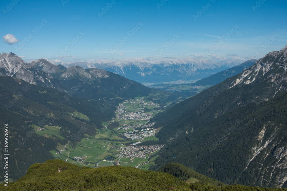 View overlooking a town in a valley between two mountain ranges. There ...