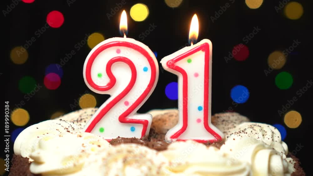 Number 21 on top of cake - twenty-one, birthday candle burning - blow ...