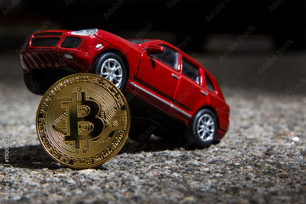 Bitcoin physical golden coin closeup with the model of red luxury ...