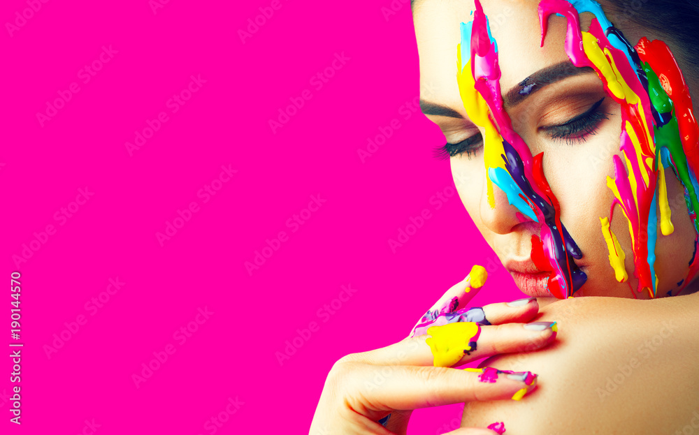Beauty model girl with colorful paint on her face. Portrait of ...