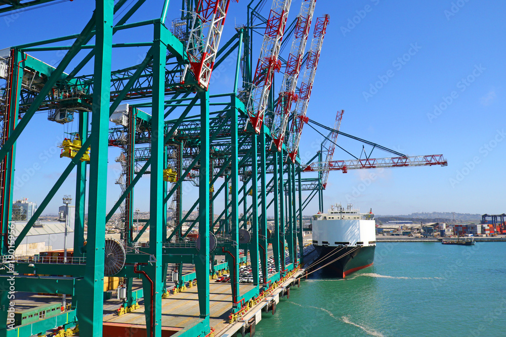 Huge container handling gantry cranes at a container terminal. Car ...