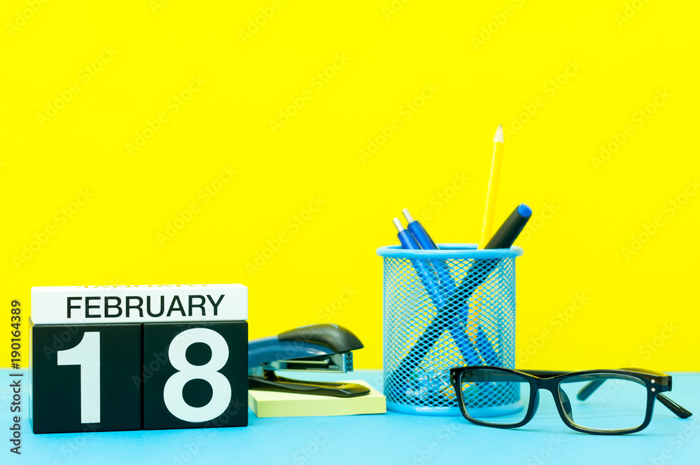 February 18th. Day 18 of february month, calendar on yellow background ...