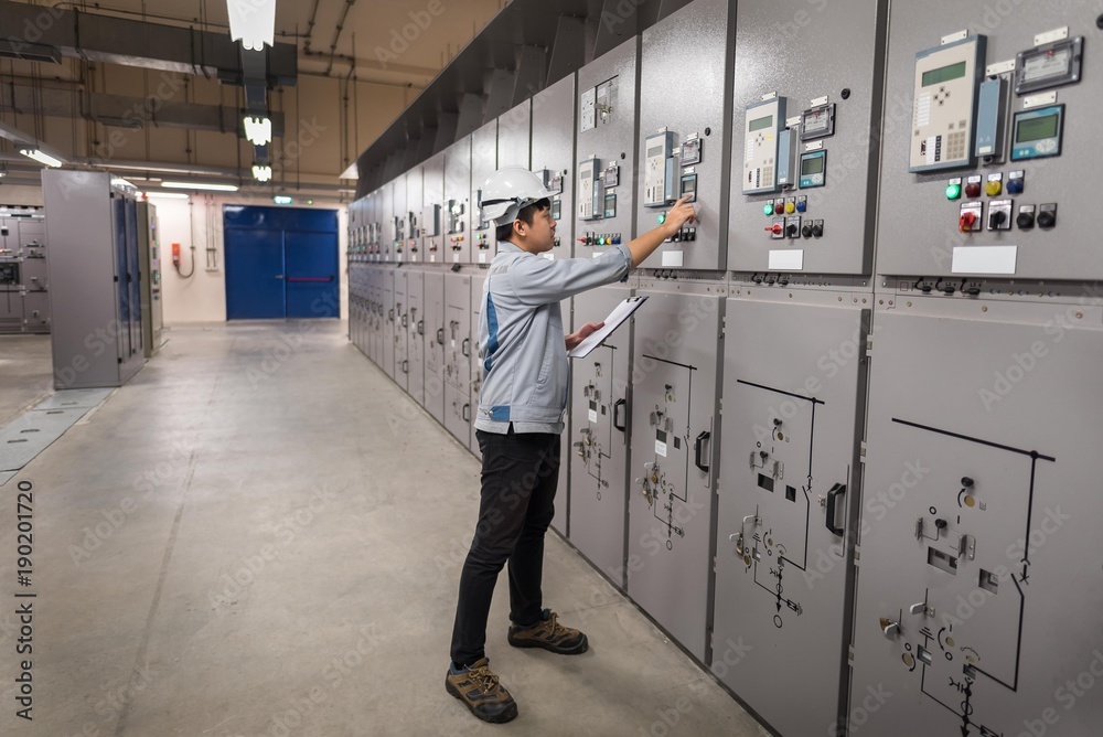 Engineer working and check status switchgear electrical energy ...