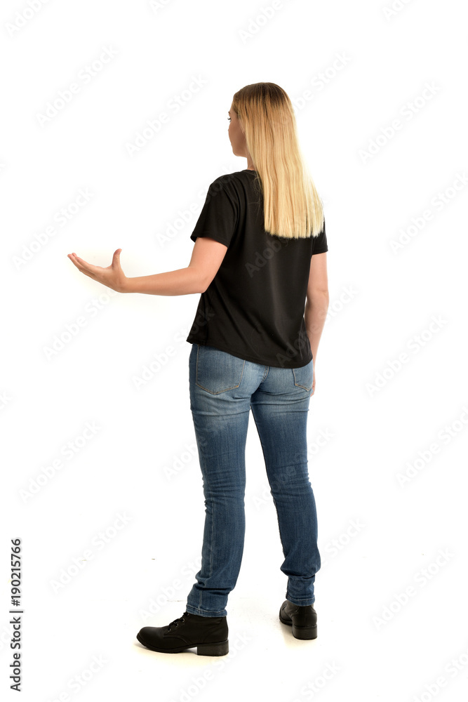 full length portrait of blonde girl wearing simple black shirt and ...