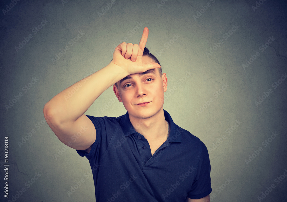 Man showing offensive loser sign Stock Photo | Adobe Stock