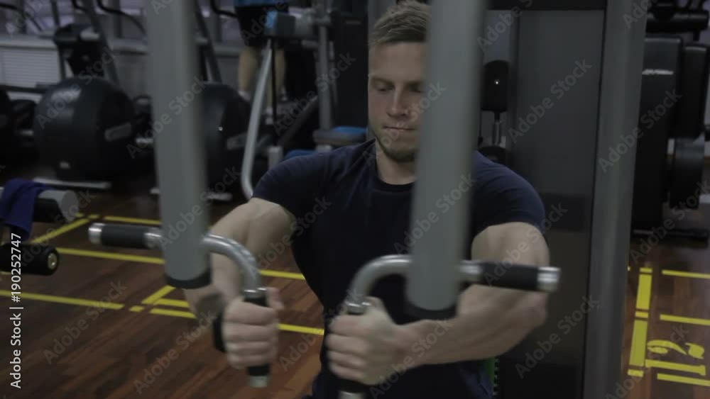 The portrait of caucasian bodybuilder who is finishing his effort in ...