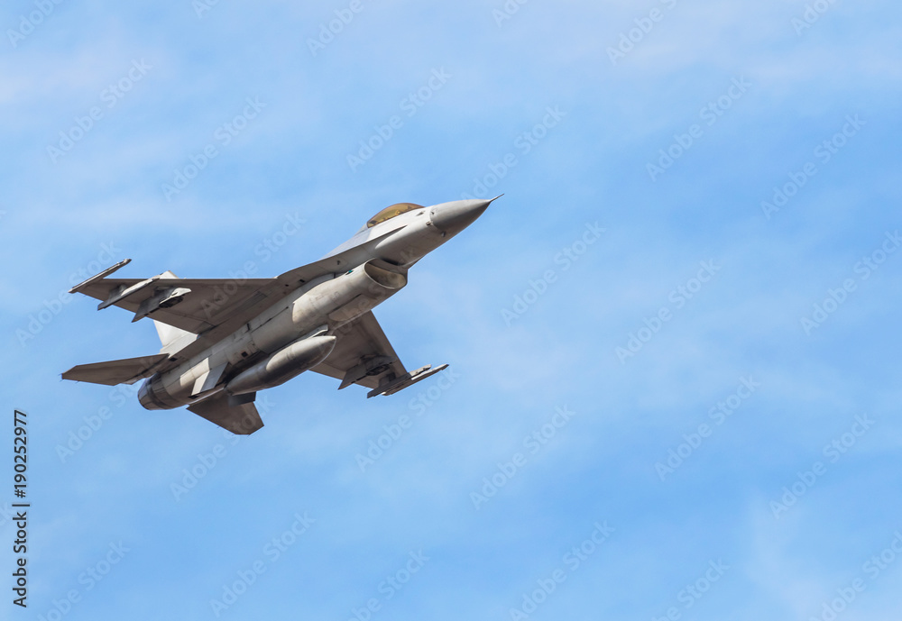 falcon fighter jet military aircraft flying on blue sky background ...