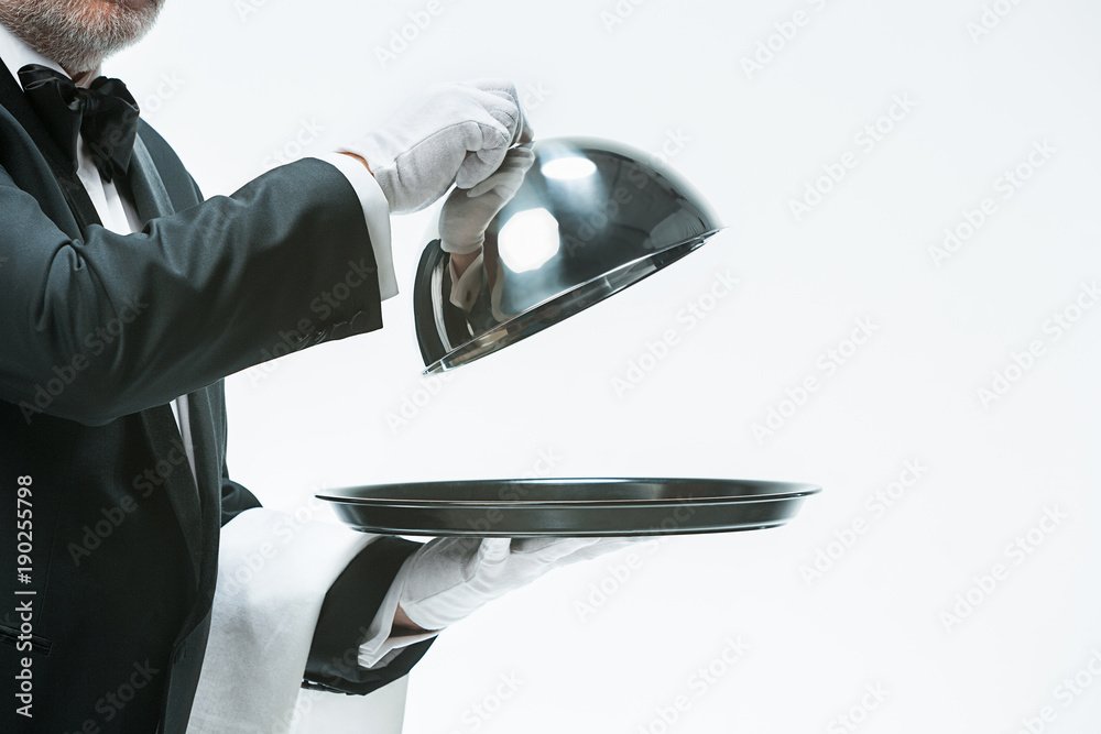Close up waiter hand with tray and metal cloche lid cover Stock 写真 ...