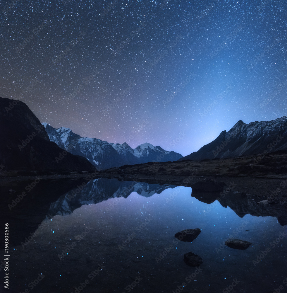Starry night in Nepal. Amazing night scene with mountains and lake ...