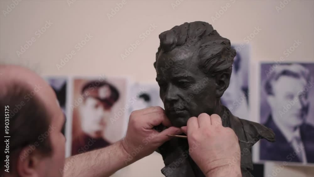 Sculptor created a figure of a man. Clip. Man creates his own hands the ...
