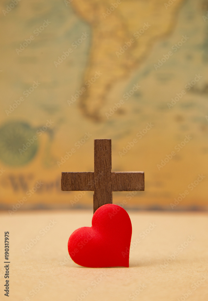 Foto de For God so loved the world - A Cross on a rustic world map do ...