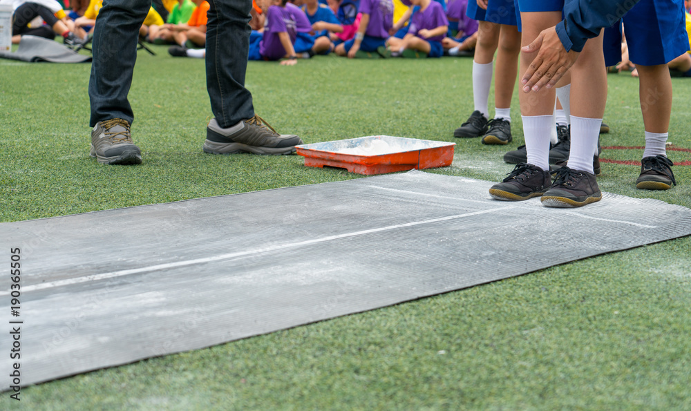 Students boy get set to jump start the starting for long jump ...