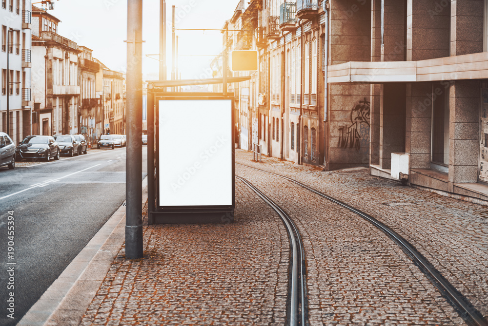 City tram stop with empty informational banner mock-up and railway ...