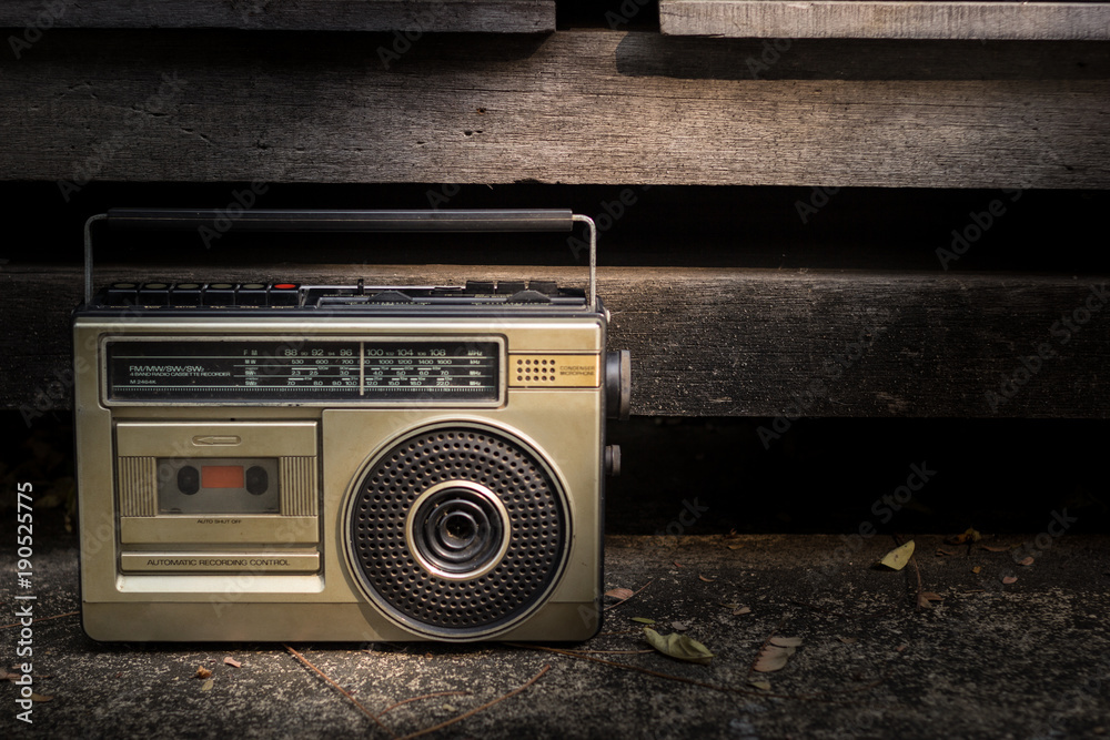 Vintage stereo in the 90s put on cement floor at roadside with wood ...