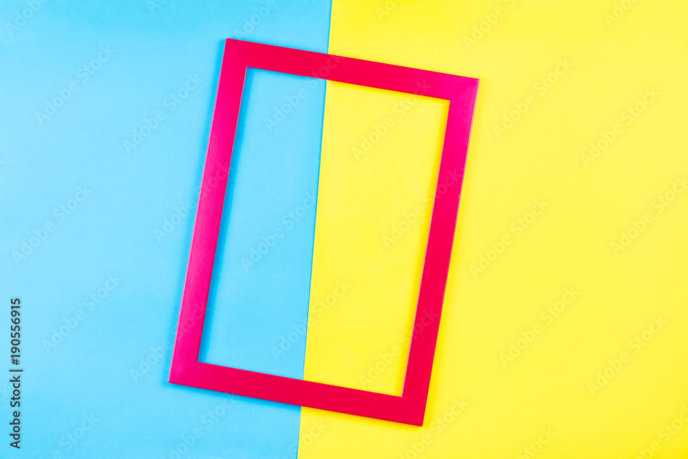 Red color frame on bright yellow and blue background. Stock Photo ...