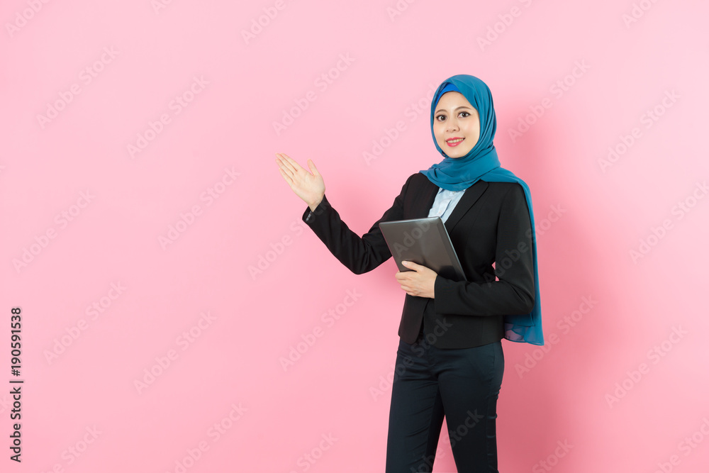 muslim lady lawyer standing in pink background Stock Photo | Adobe Stock