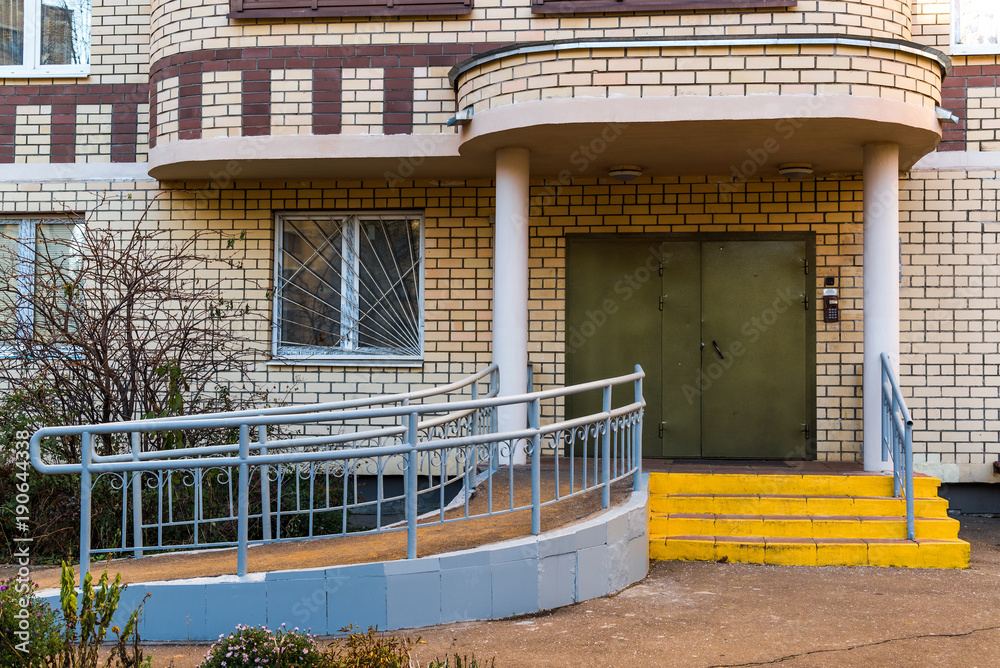 Entrance to modern high-rise building made of bricks. Stock Photo ...