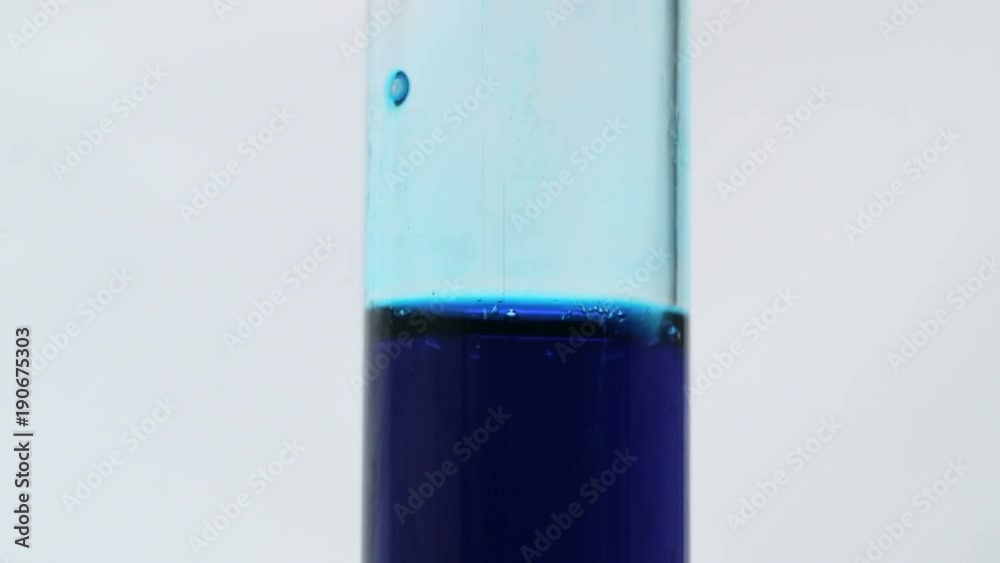 Chemical reaction in a glass vial. Determination of acidity. Reaction ...
