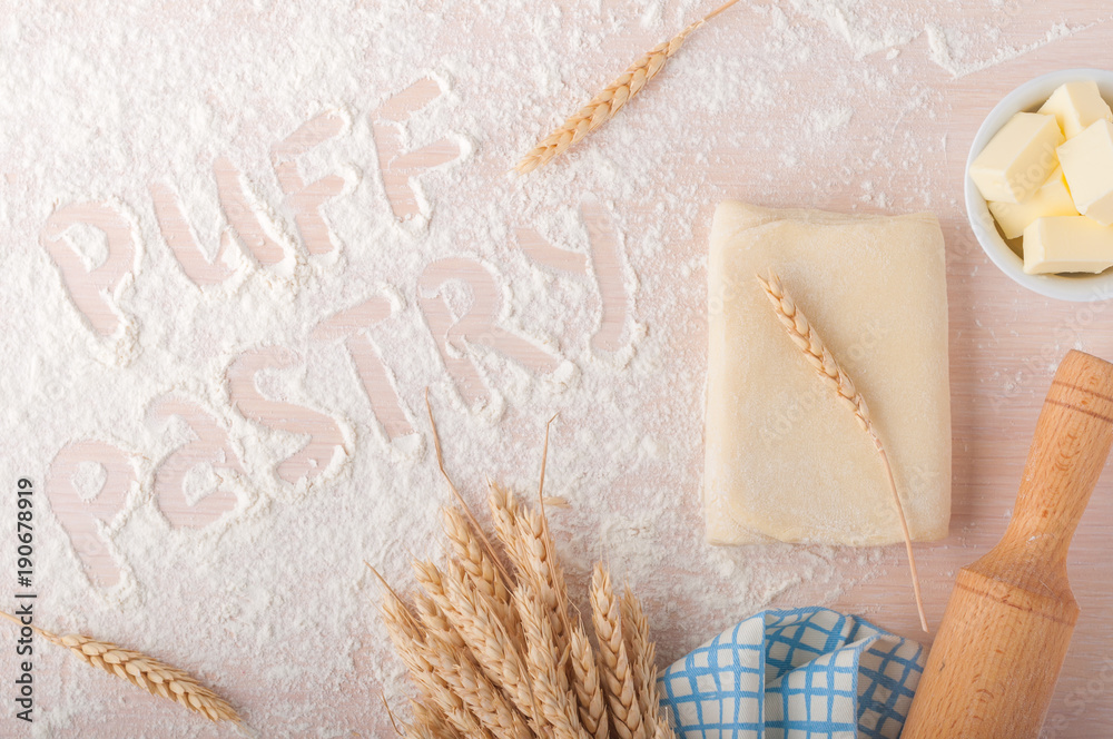 Puff pastry lettering (inscription). Homemade raw puff pastry dough on ...