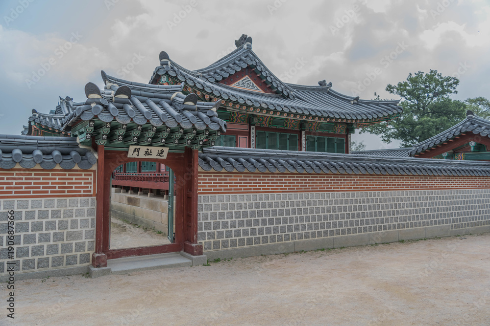 decorative wall, a fancy entry way, with tiled roof, and other fancy ...